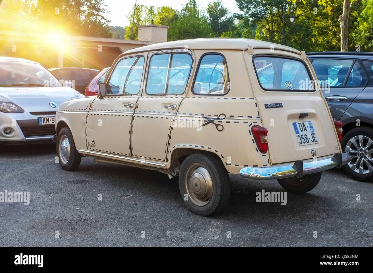 A Renault 4 car with comedy cut here graphics. Photographed in France ...