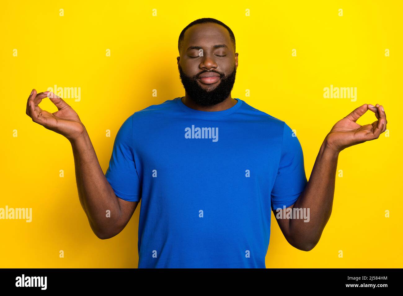 Portrait of attractive calm dreamy guy meditating developing inner ...