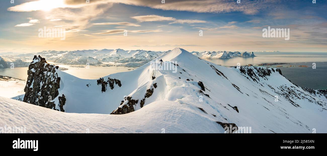 Panorama photo, lone climber on the summit ridge of Husafjellet, Senja ...