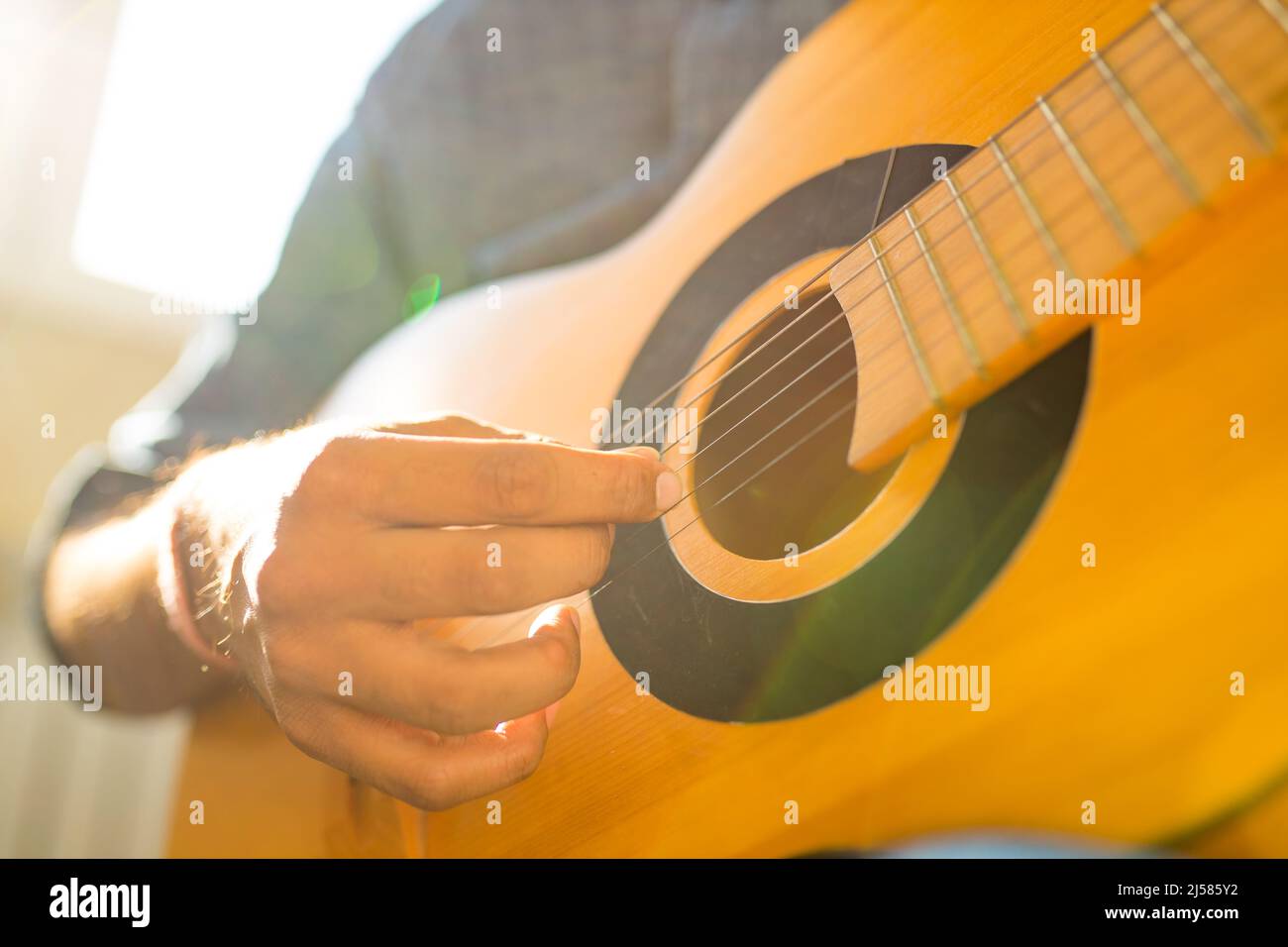 Handsome young man playing guitar hi-res stock photography and images ...