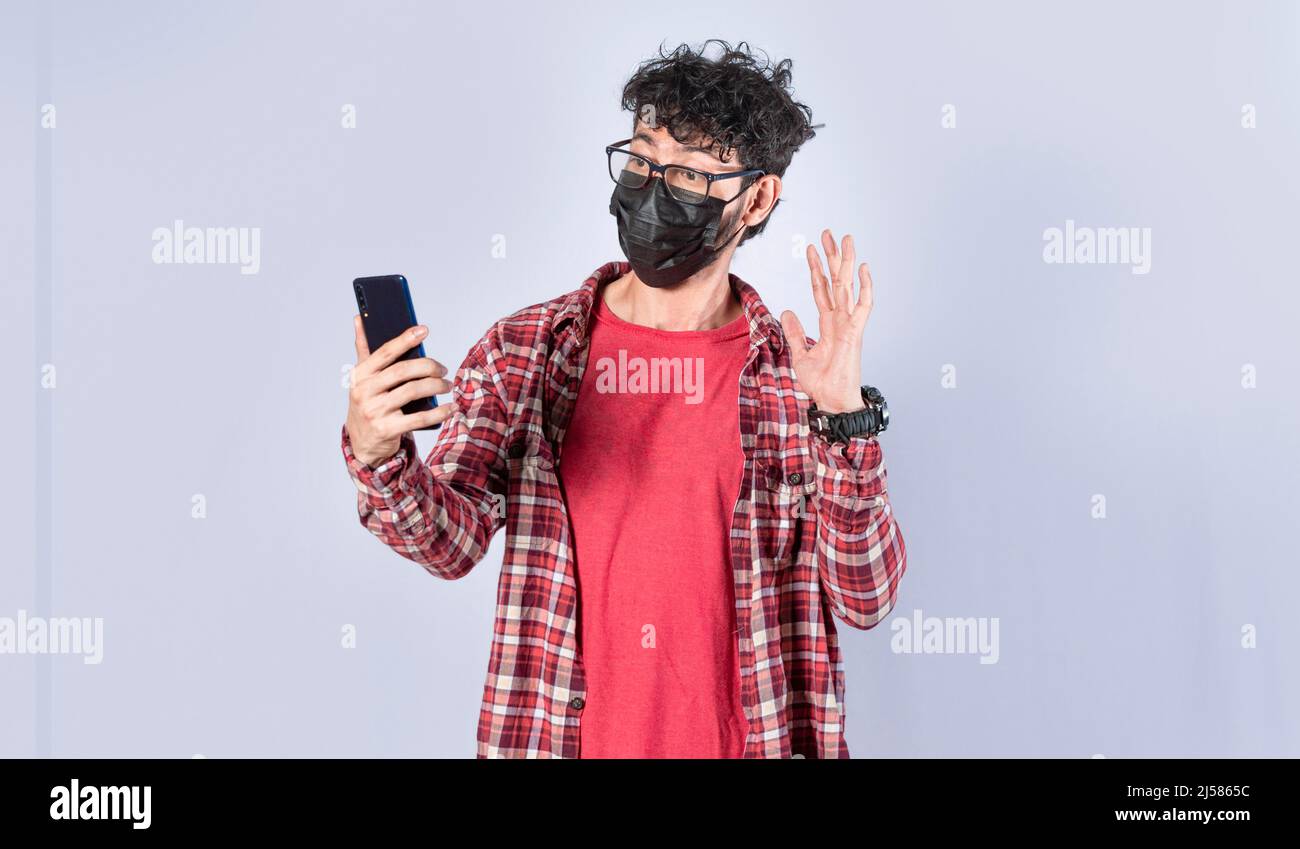 Man making video call isolated, guy making video call with face mask ...