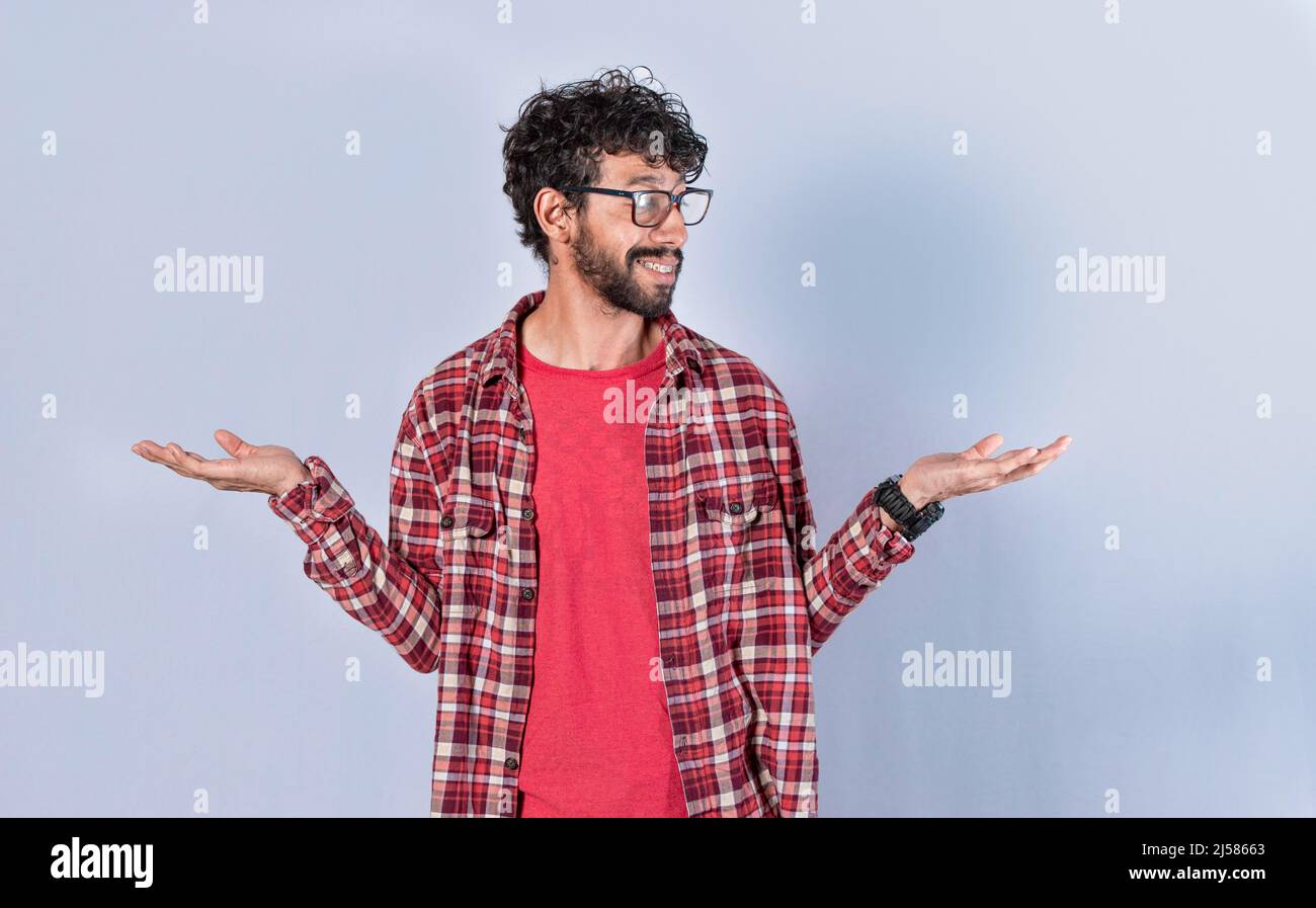 Man balancing the palms of his hands, man comparing with the palms of ...