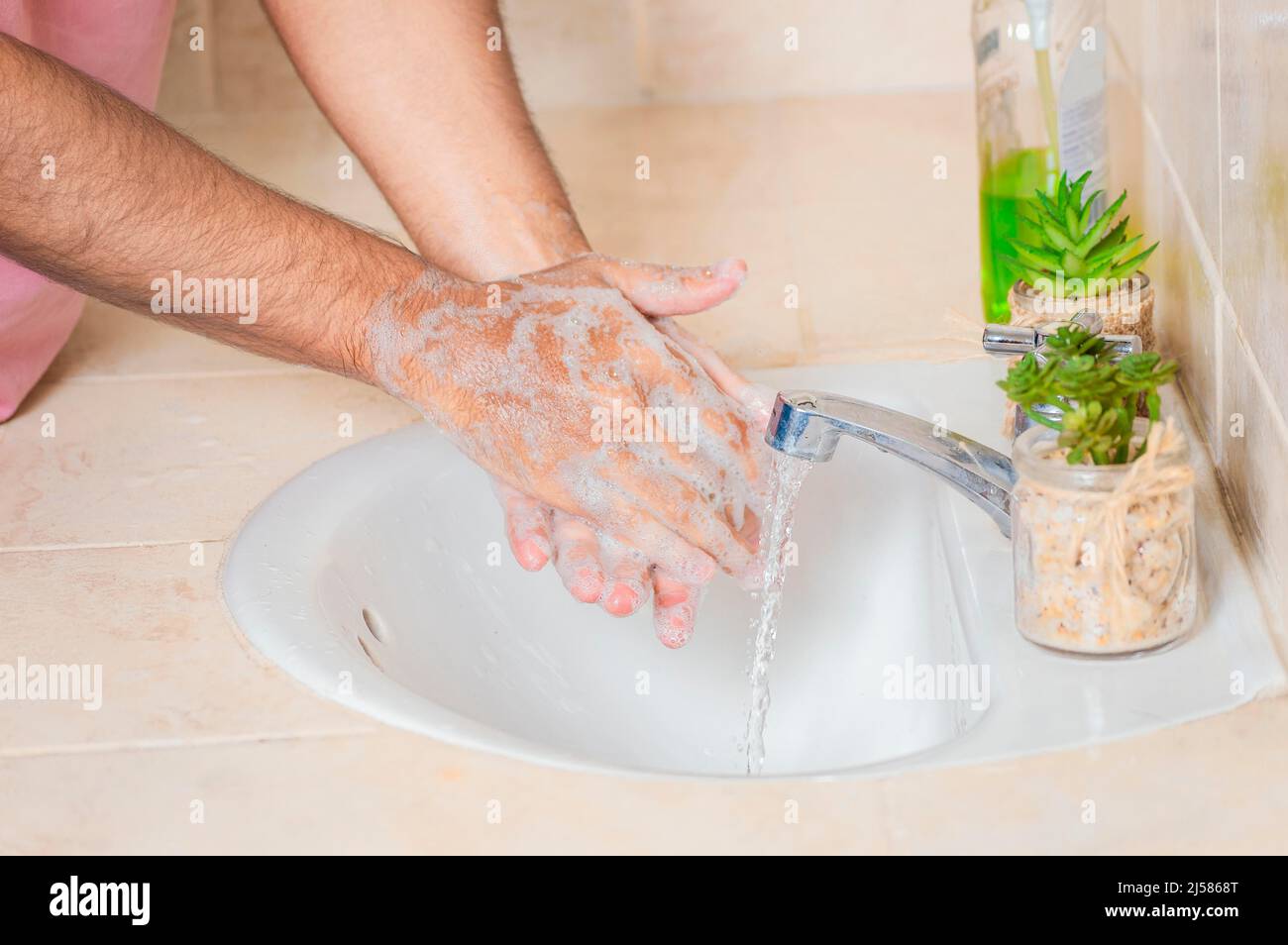 Close up of a man washing their hands with soap, concept of correct ...