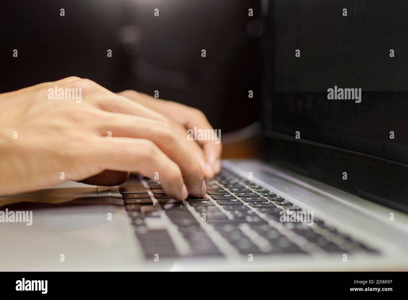 Hands on laptop keyboard, close up of hands on keyboard Stock Photo - Alamy