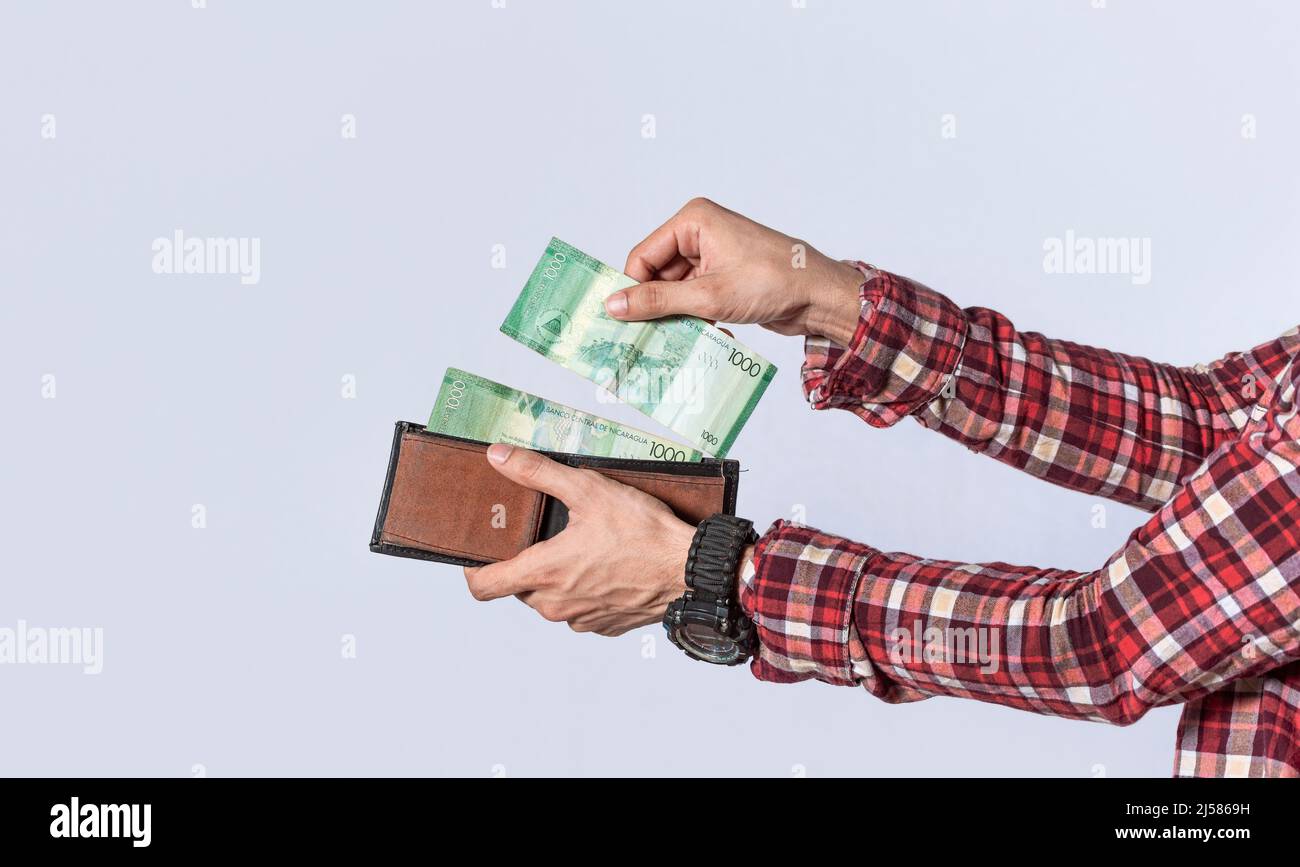 Man taking money out of his wallet, close up of hands taking money out ...
