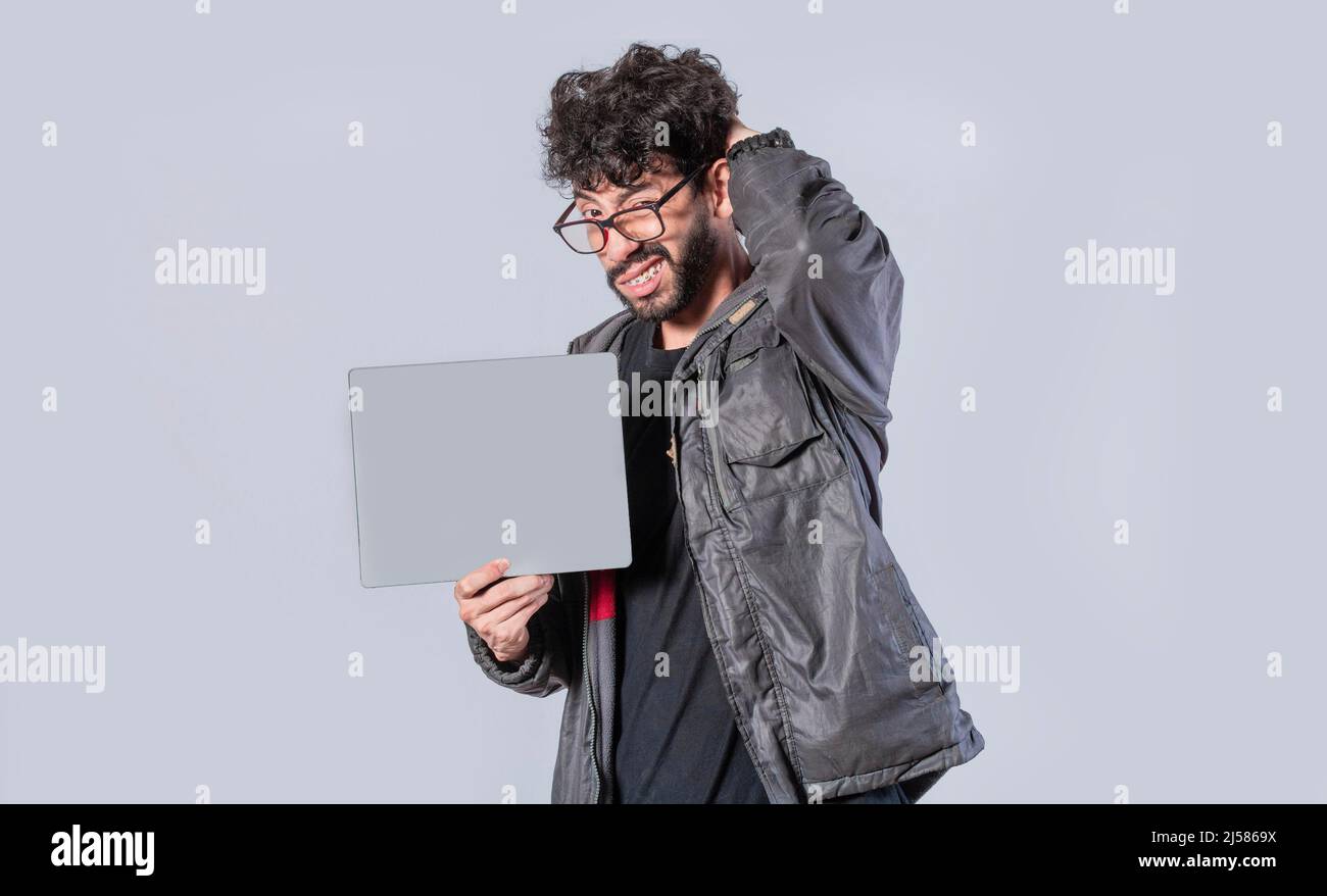 Young man with hand on head showing poster, man showing blank signboard ...
