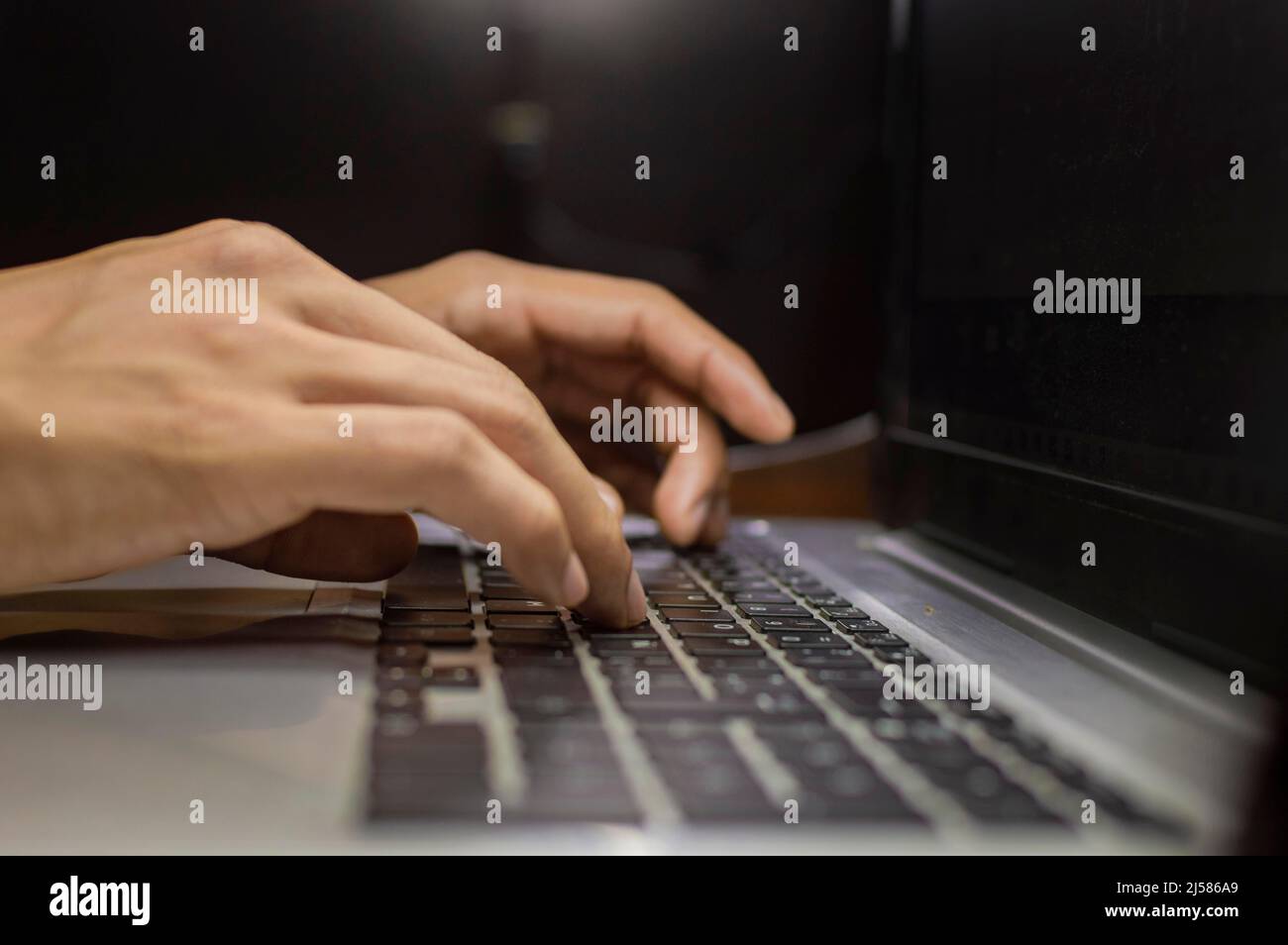 Hands on laptop keyboard, close up of hands on keyboard Stock Photo - Alamy