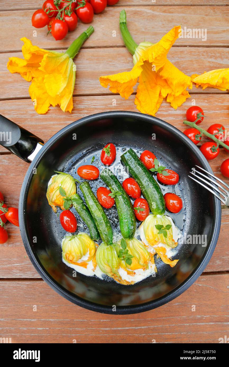 Southern German cuisine, stuffed courgette flowers sauteed in pan ...