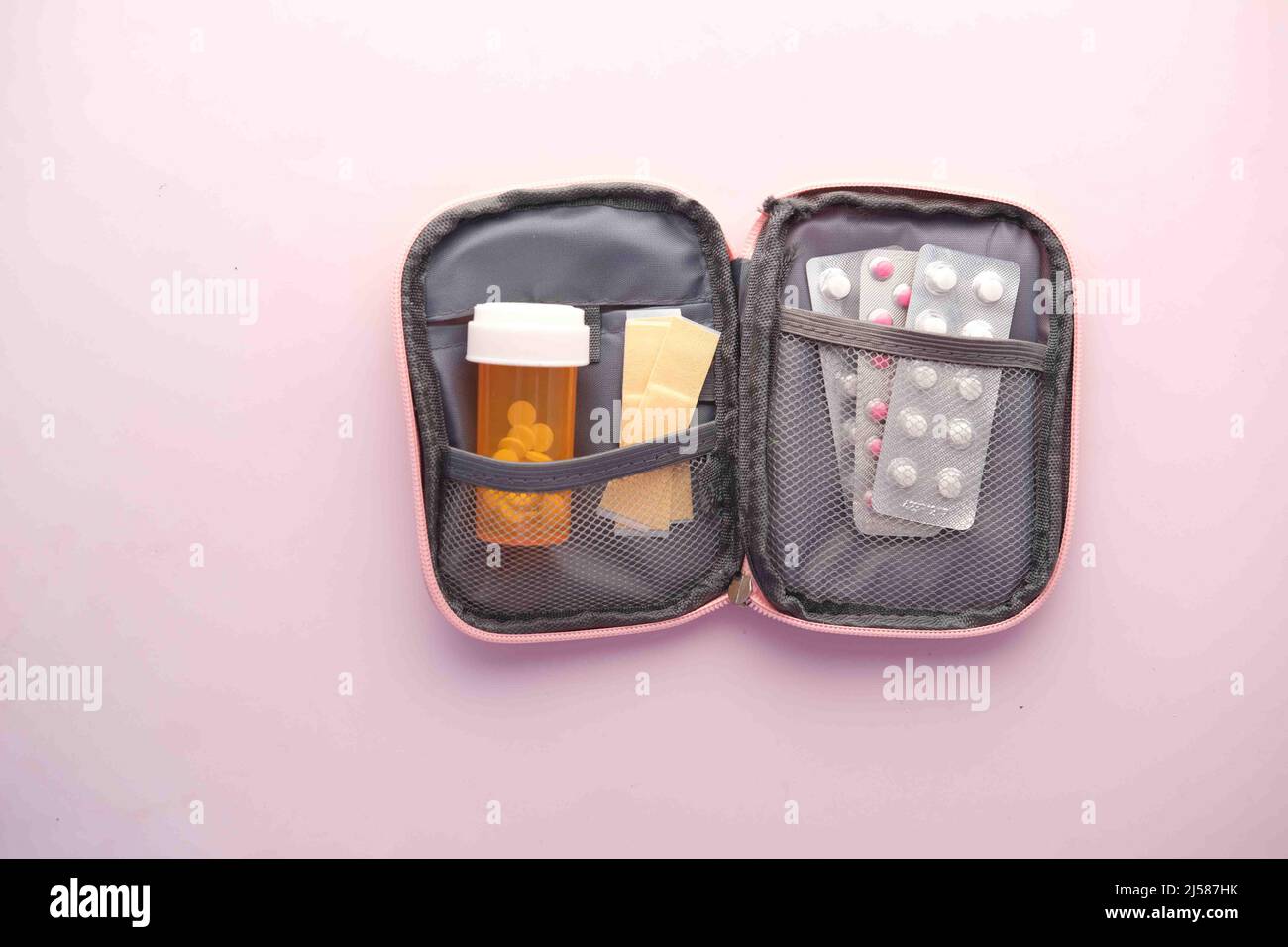 medical pill container, blister pack and bandage in a small bag Stock ...