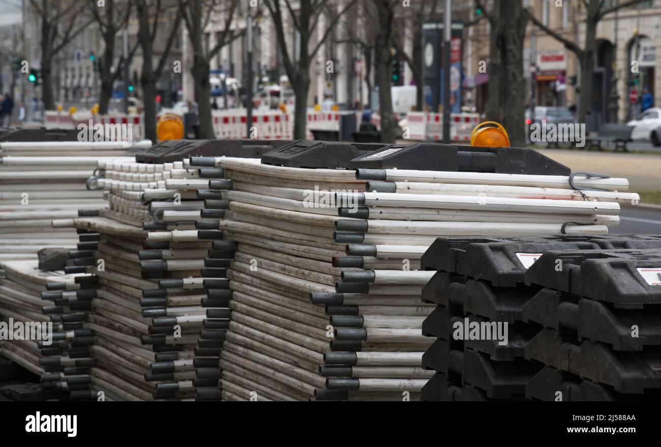 A stack of barrier fences for possible road closures in the street ...