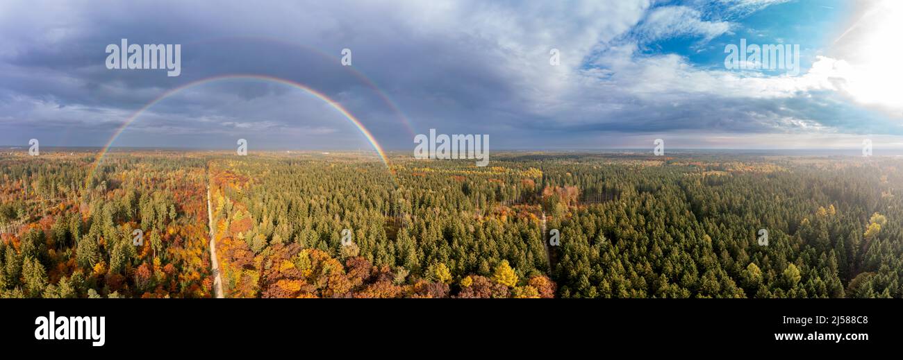 Aerial of a complete rainbow over a forest in autumn colours Stock ...