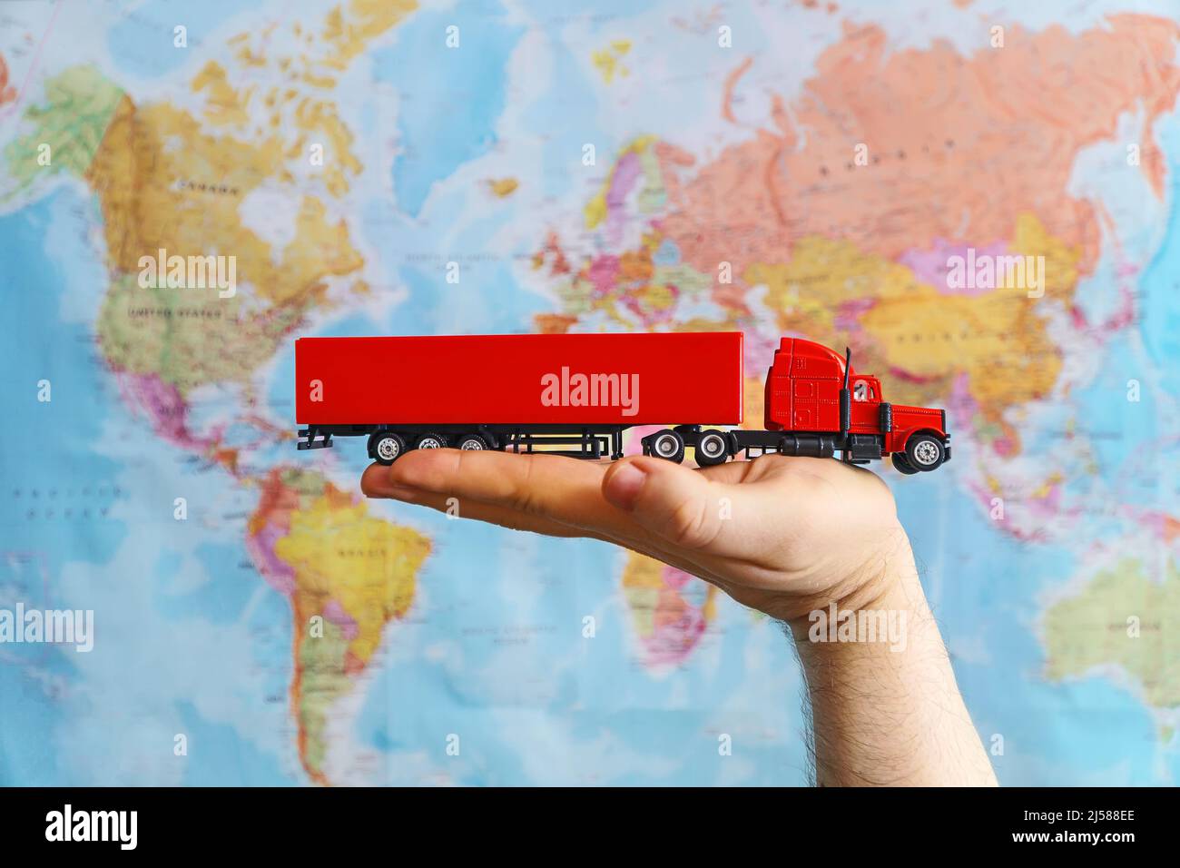 International cargo transportation concept. Model truck toy over map ...