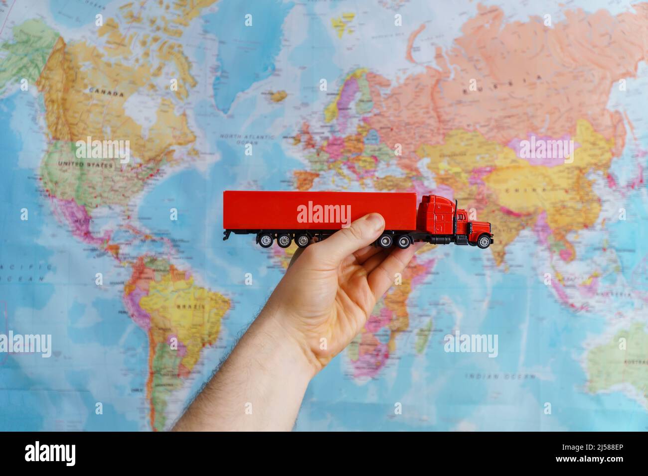 International cargo transportation concept. Model truck toy over map ...