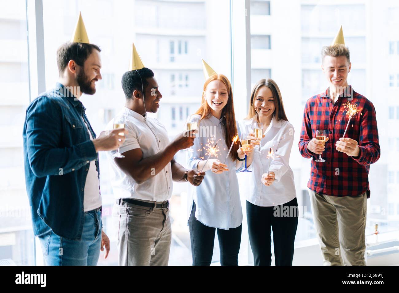Successful business team of young multiracial colleagues holding Bengal ...