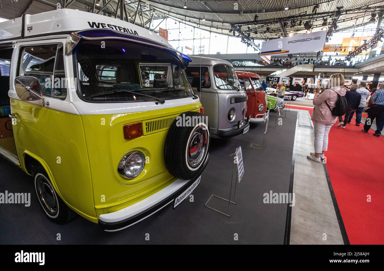 Stuttgart, Germany. 21st Apr, 2022. Visitors look at various old VW ...