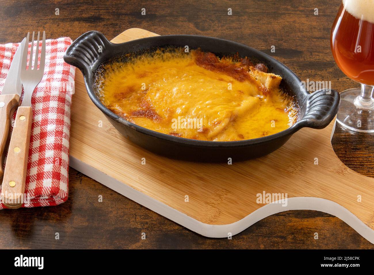 top view of a welsh on a board with a beer on a table Stock Photo - Alamy