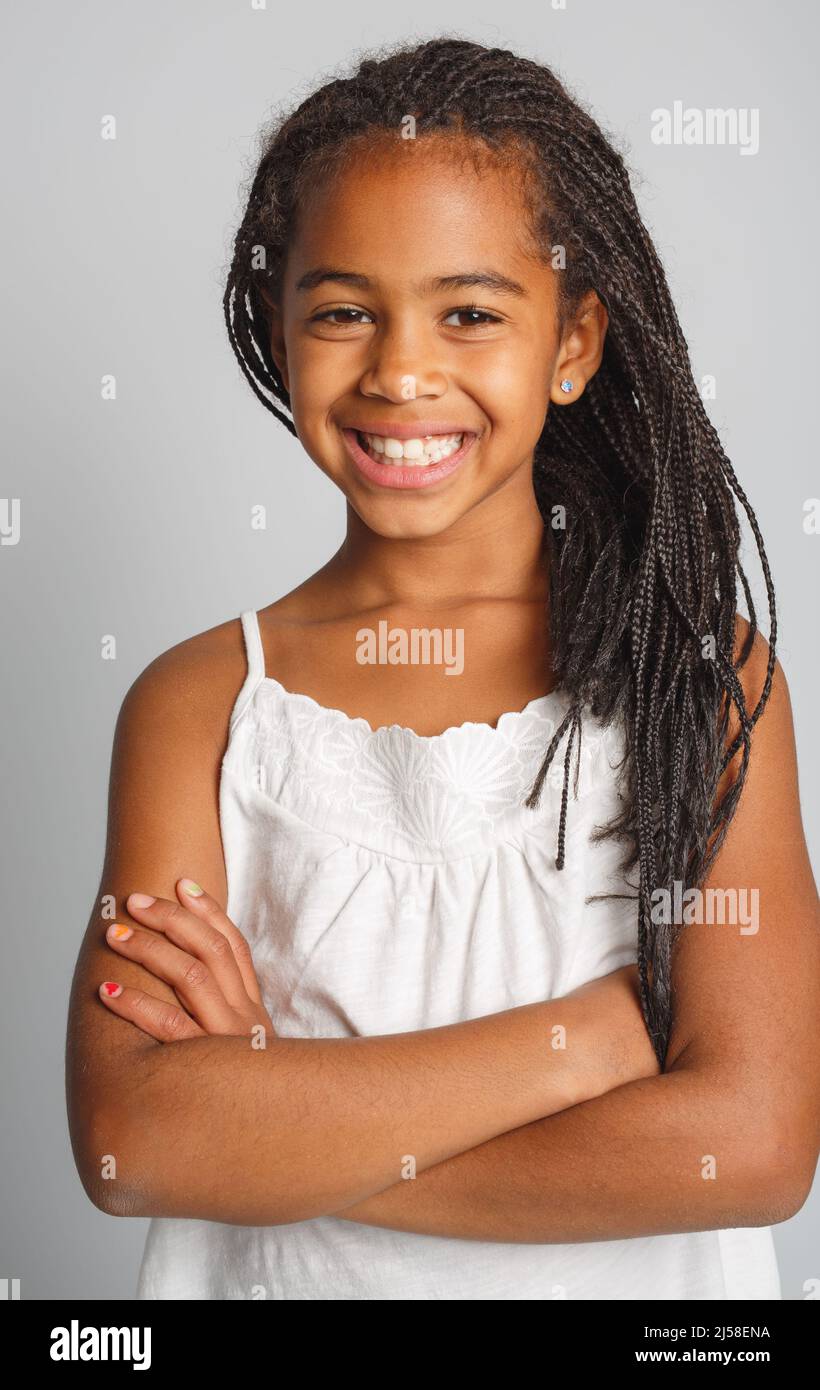 Adorable african little girl on studio white background Stock Photo - Alamy