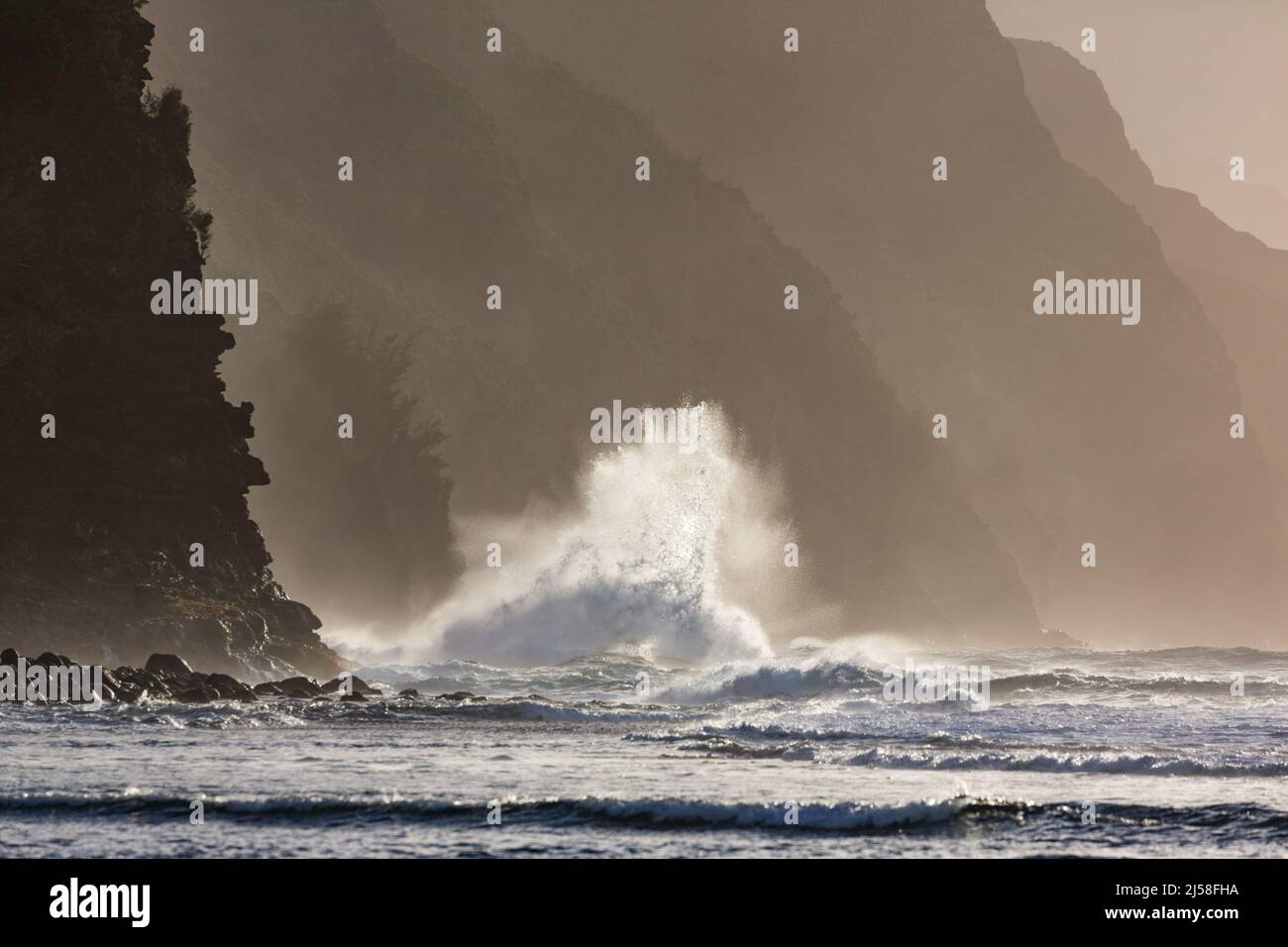 An explosion of water created by colliding outgoing and incoming waves ...