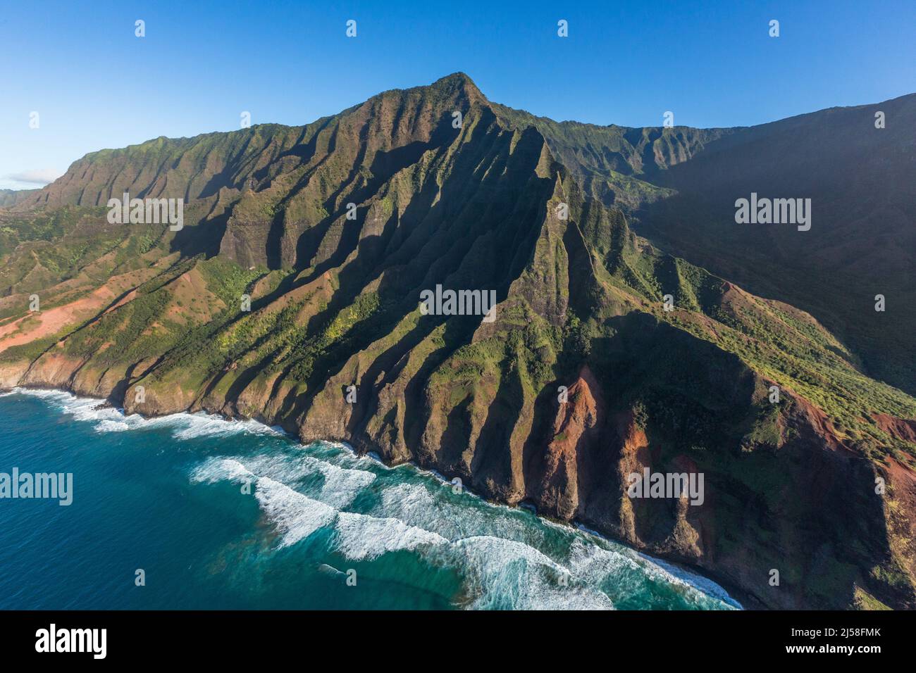 Pacific Ocean waves break on the Na Pali Cliffs in the Na Pali Coast ...