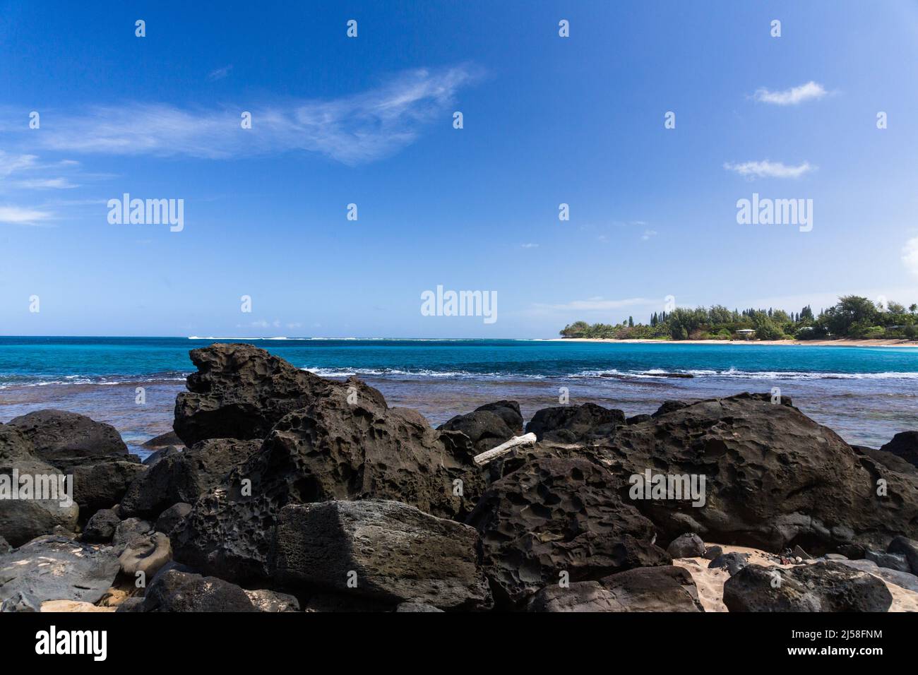Volcanic basalt boulders on Haena Beach on the Island of Kauai, Hawaii ...