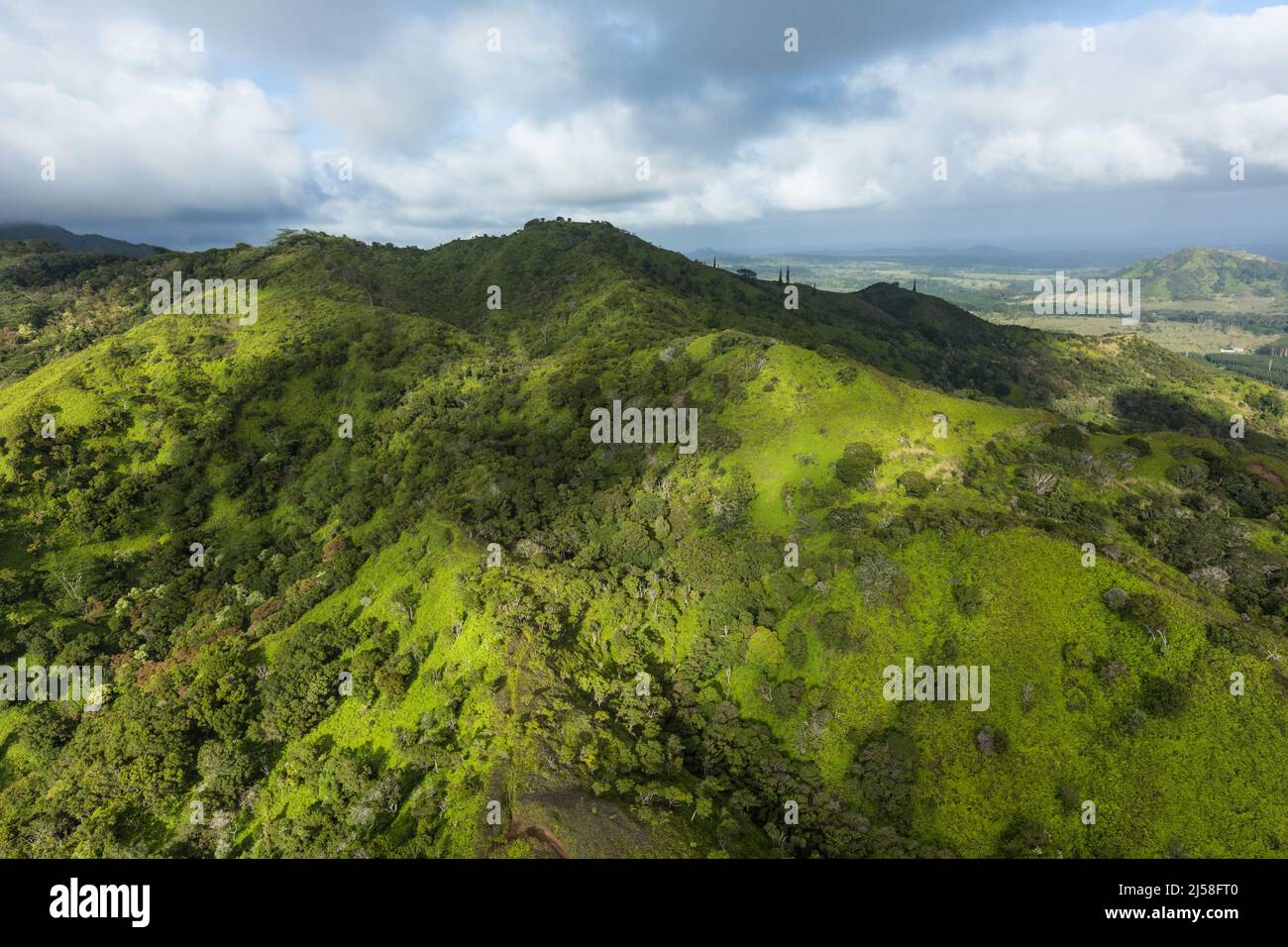 Aerial view of Kahuamoa mountain with Omoe in the distance at right ...