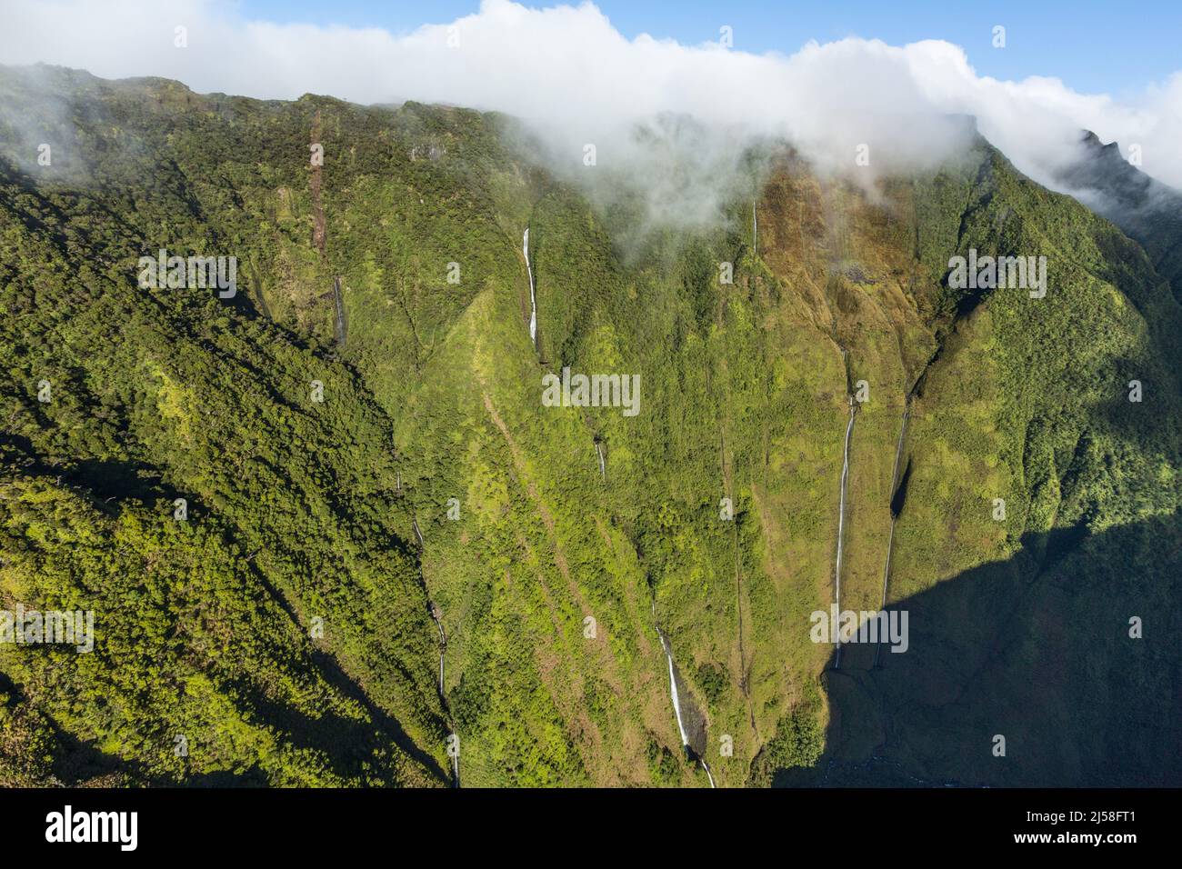 Waterfalls plunge more than 2,000 feet from the Alakai Plateau into the ...