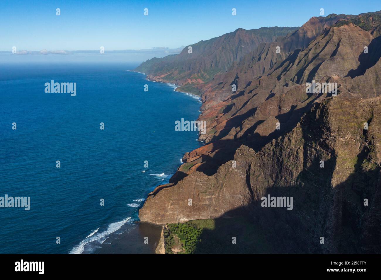 An aerial view of the rugged Na Pali cliffs on the Pacific Ocean in the ...