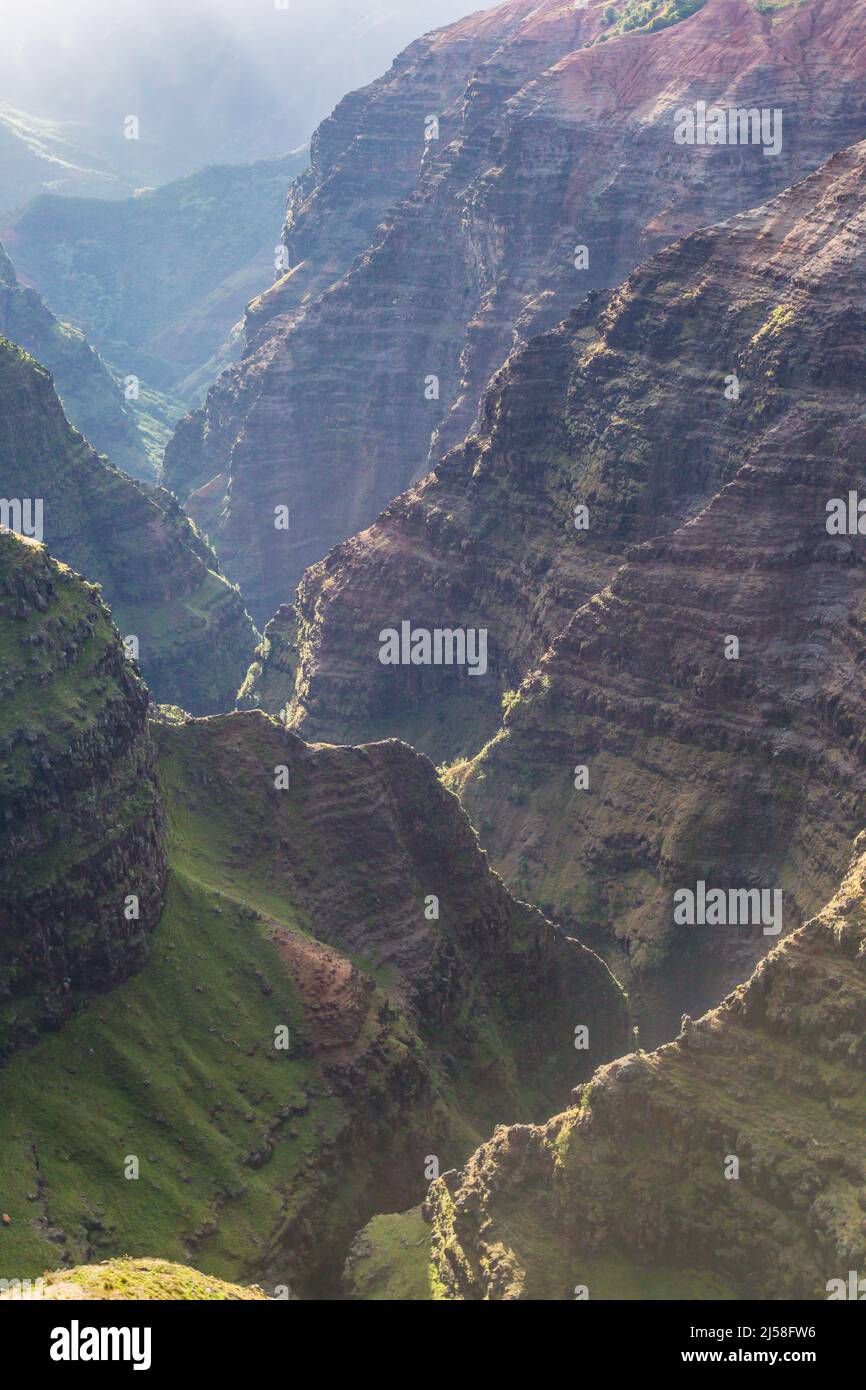 Flying down the rugged Waialae Canyon in a helicopter. Waimae Canyon ...