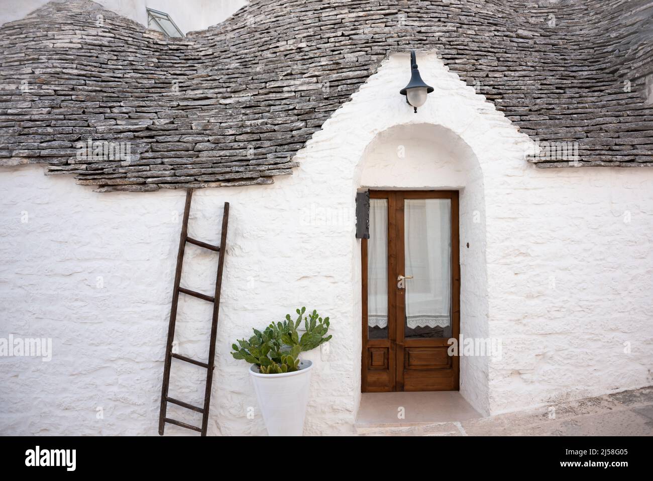 Alberobello town in Italy, famous for its traditional trullo houses ...