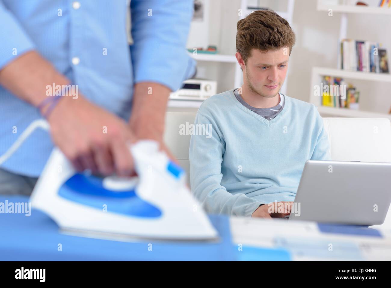 son and father household chores Stock Photo - Alamy
