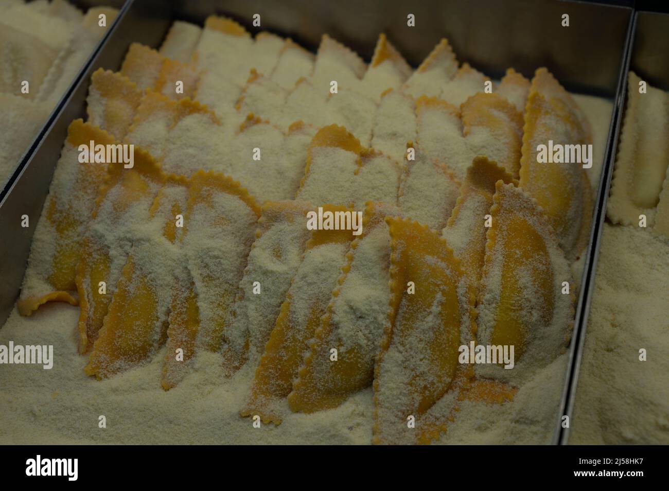 Italian food, handmade mezzaluna pasta ravioli stuffed with four ...