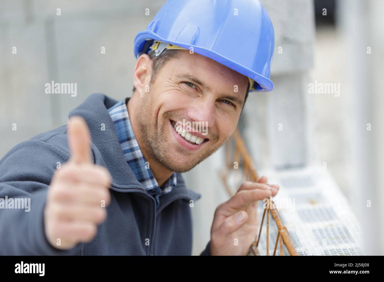 happy builder is showing thumb up Stock Photo - Alamy
