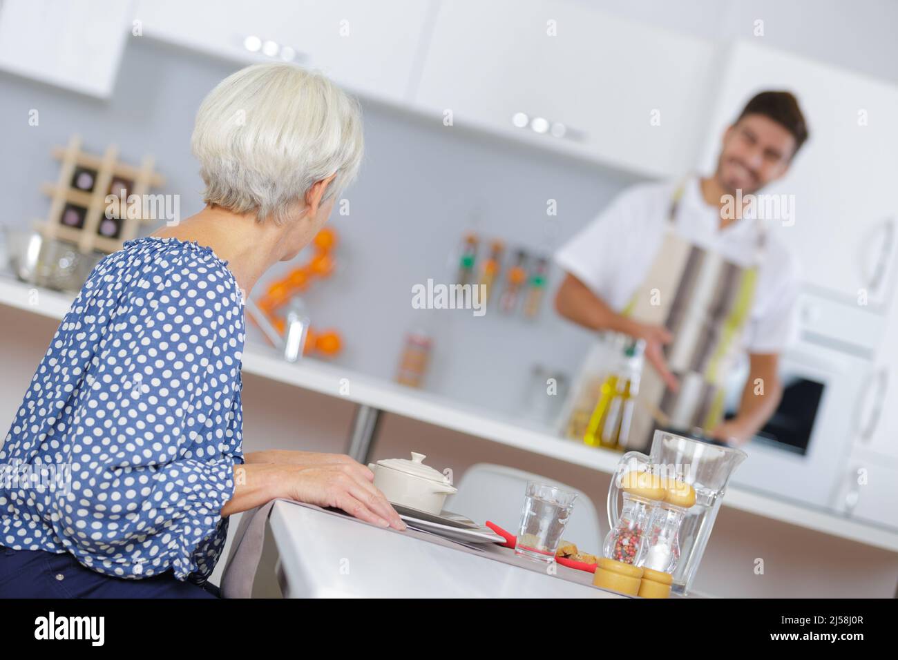 Care home elderly young people visiting hi-res stock photography and ...