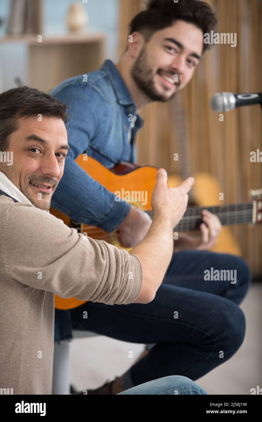 two talented men are playing guitar Stock Photo - Alamy