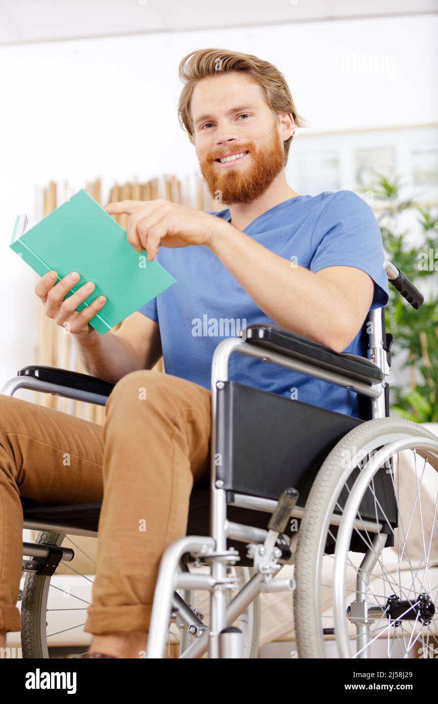 portrait of man reading a book at the window Stock Photo - Alamy