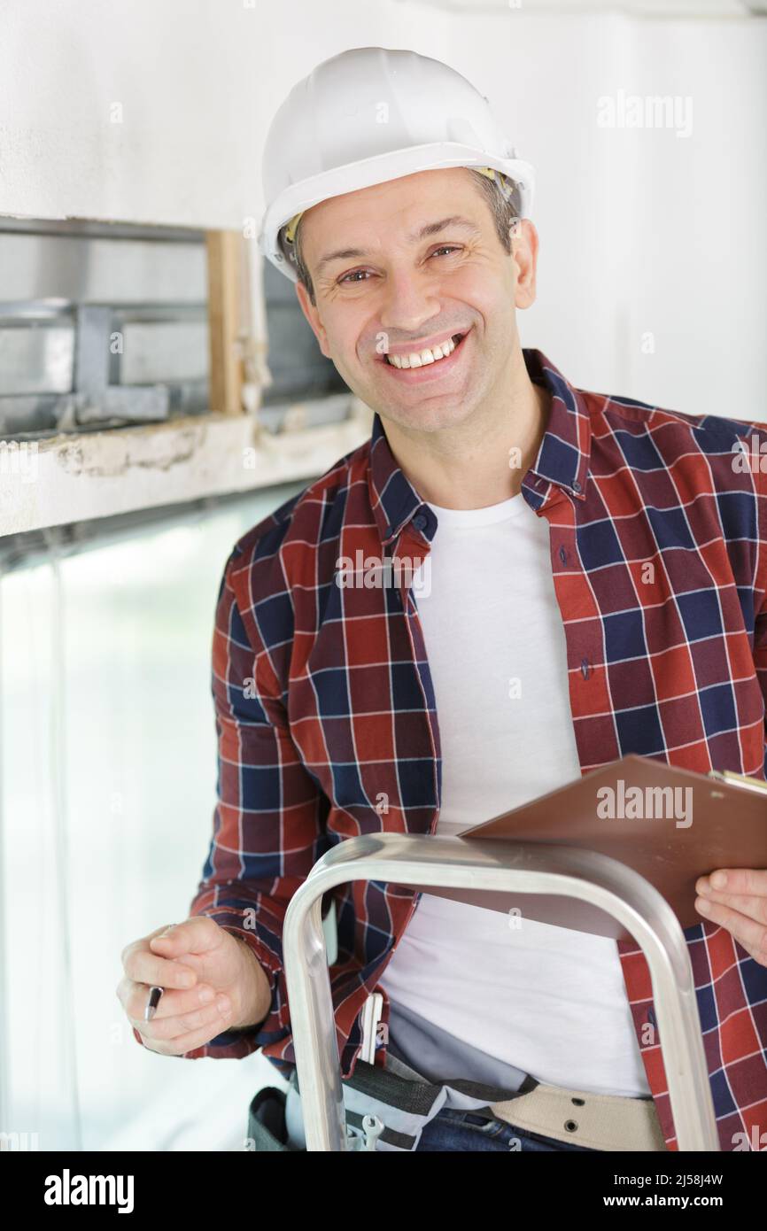man building or repairing a house Stock Photo - Alamy