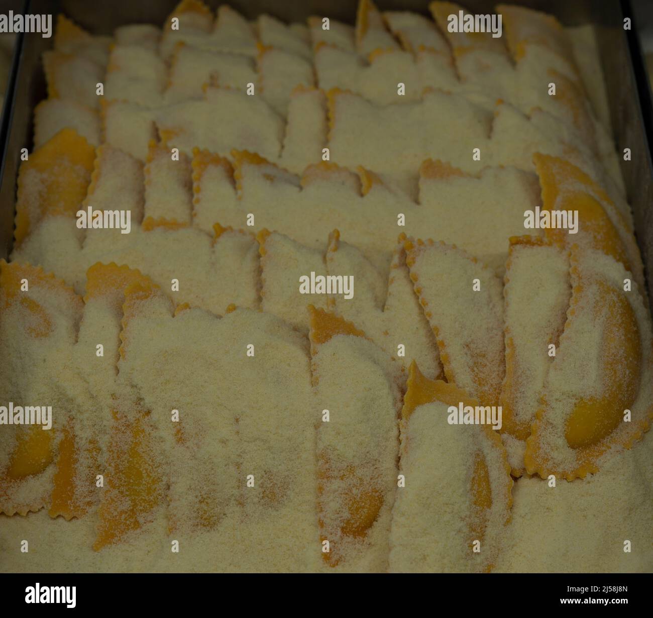 Italian food, handmade mezzaluna pasta ravioli stuffed with four ...