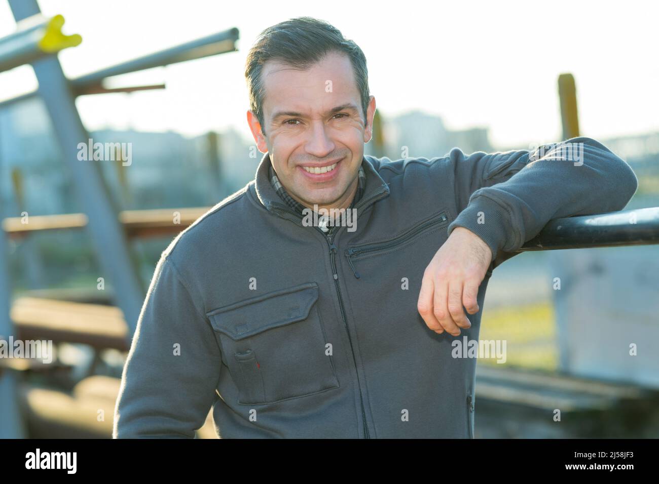 portrait of male engineer outside factory Stock Photo - Alamy