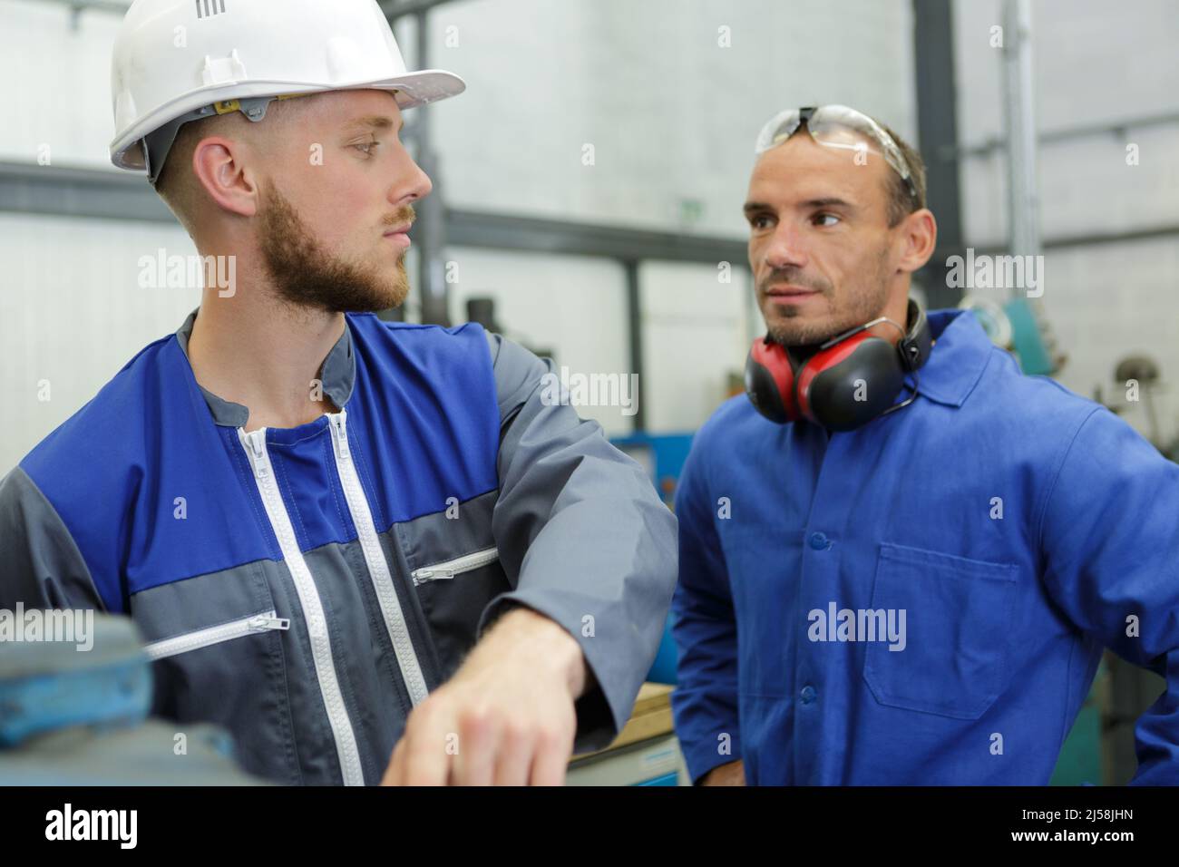two engineers talking in a factory Stock Photo - Alamy