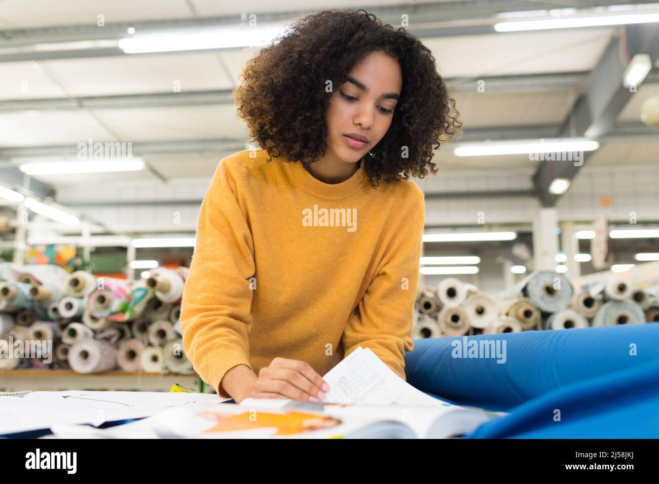 female tailor in thread factory Stock Photo - Alamy