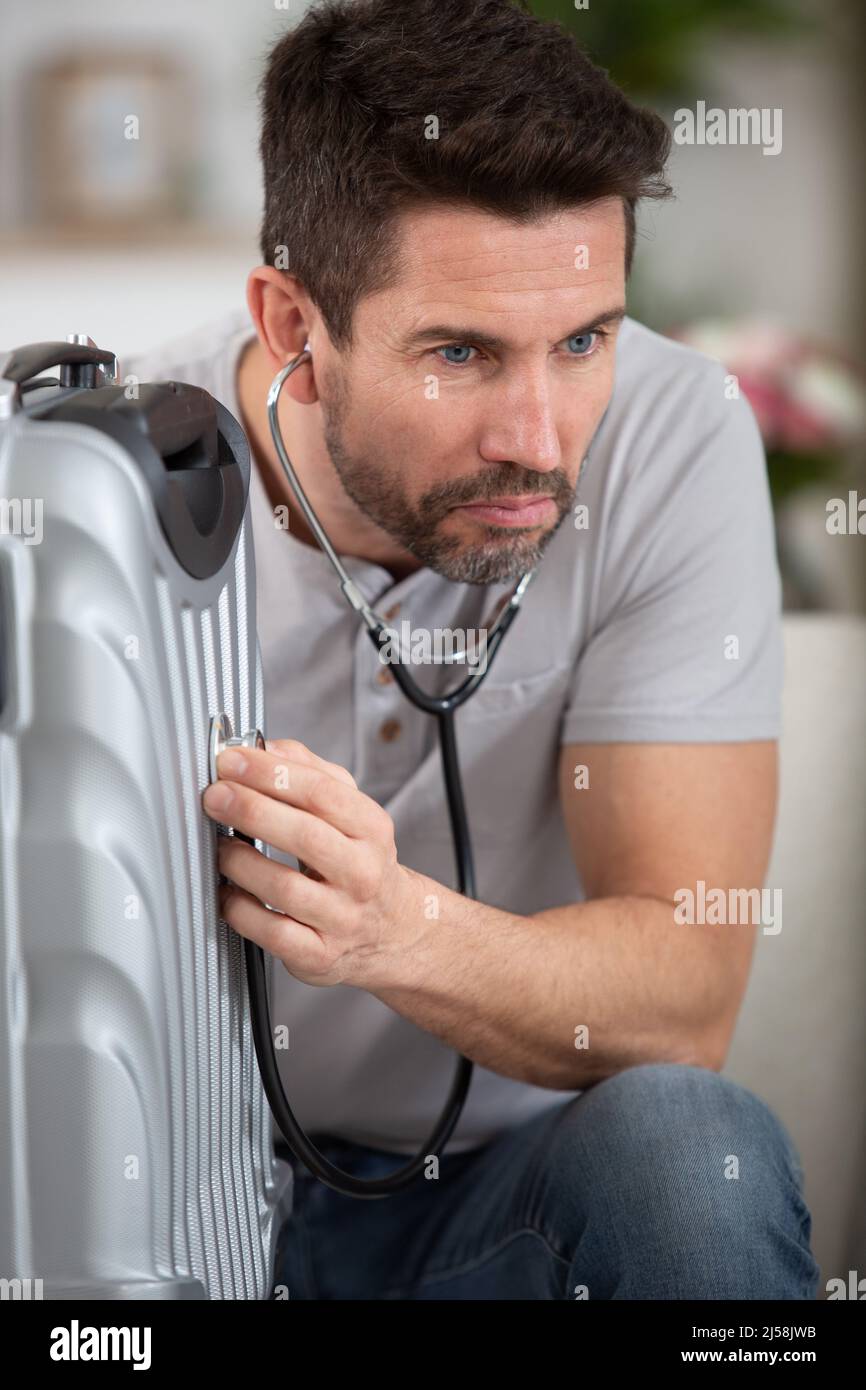 Guy inside suitcase hi-res stock photography and images - Alamy