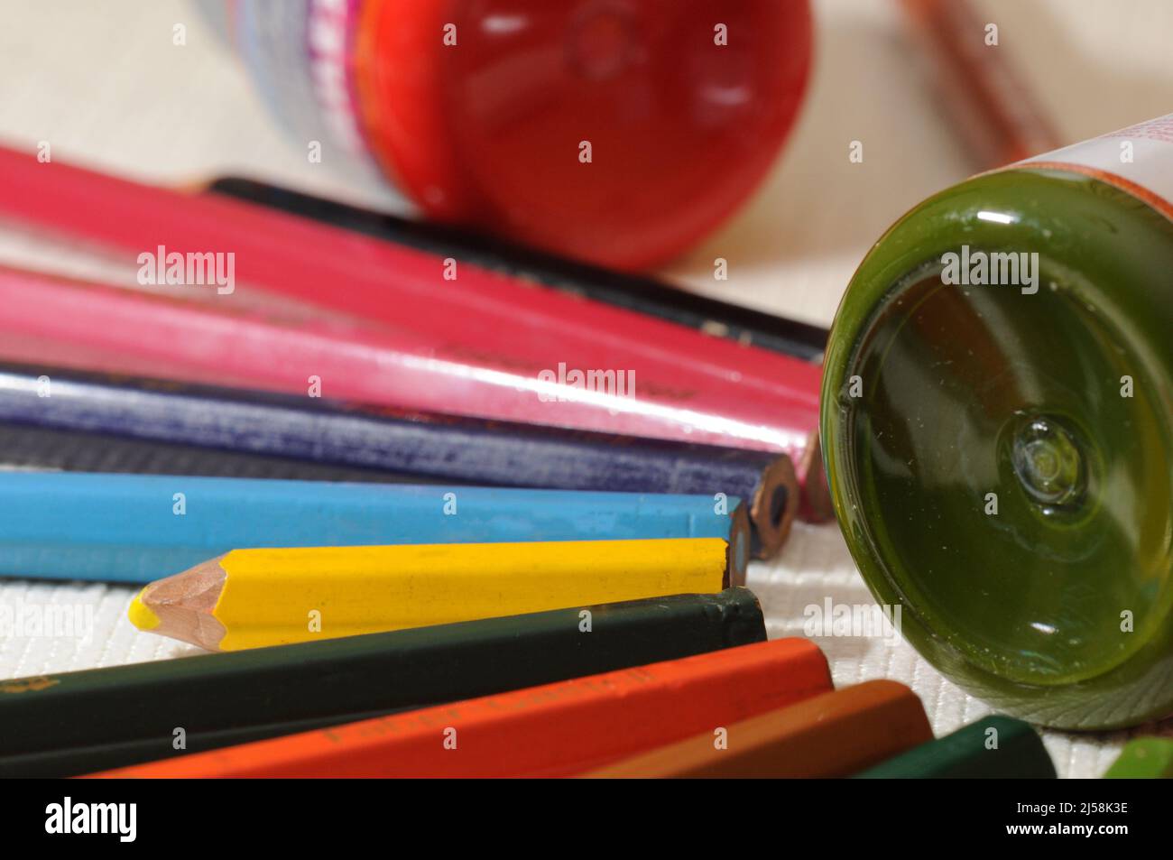 Colorful and funny arrangement of a set of pencils and ink pots Stock ...