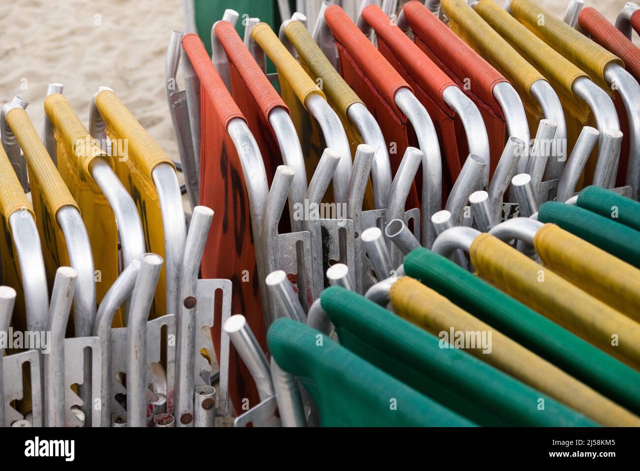 Deck chairs are being packed after a beach day at Copacabana beach, Rio ...