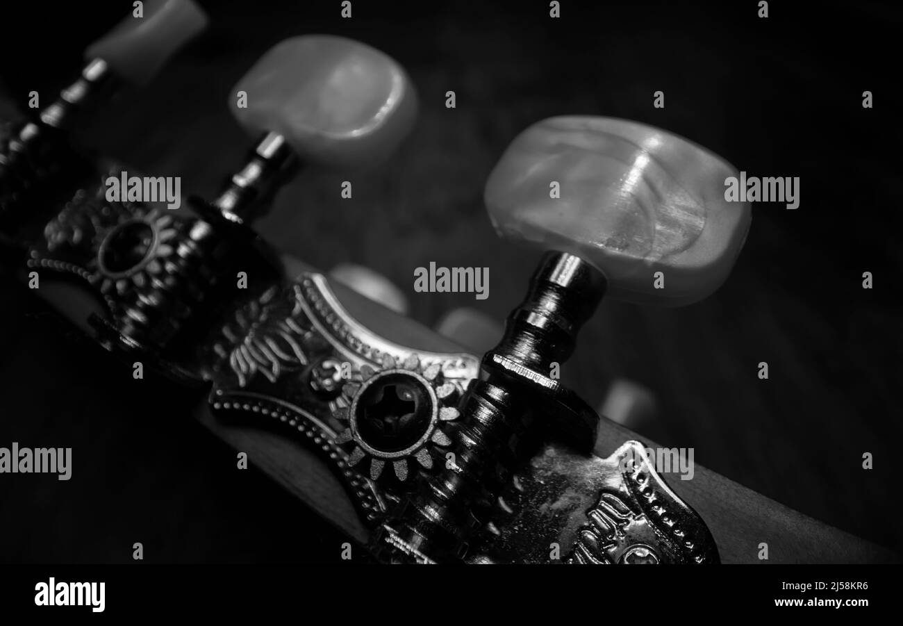 Guitar pegs on a six-string Spanish guitar Stock Photo - Alamy