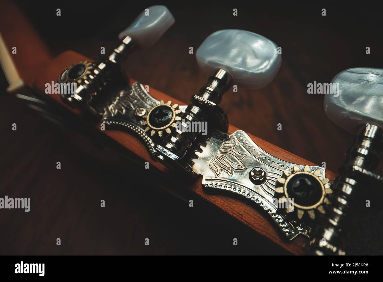 Guitar pegs on a six-string Spanish guitar Stock Photo - Alamy