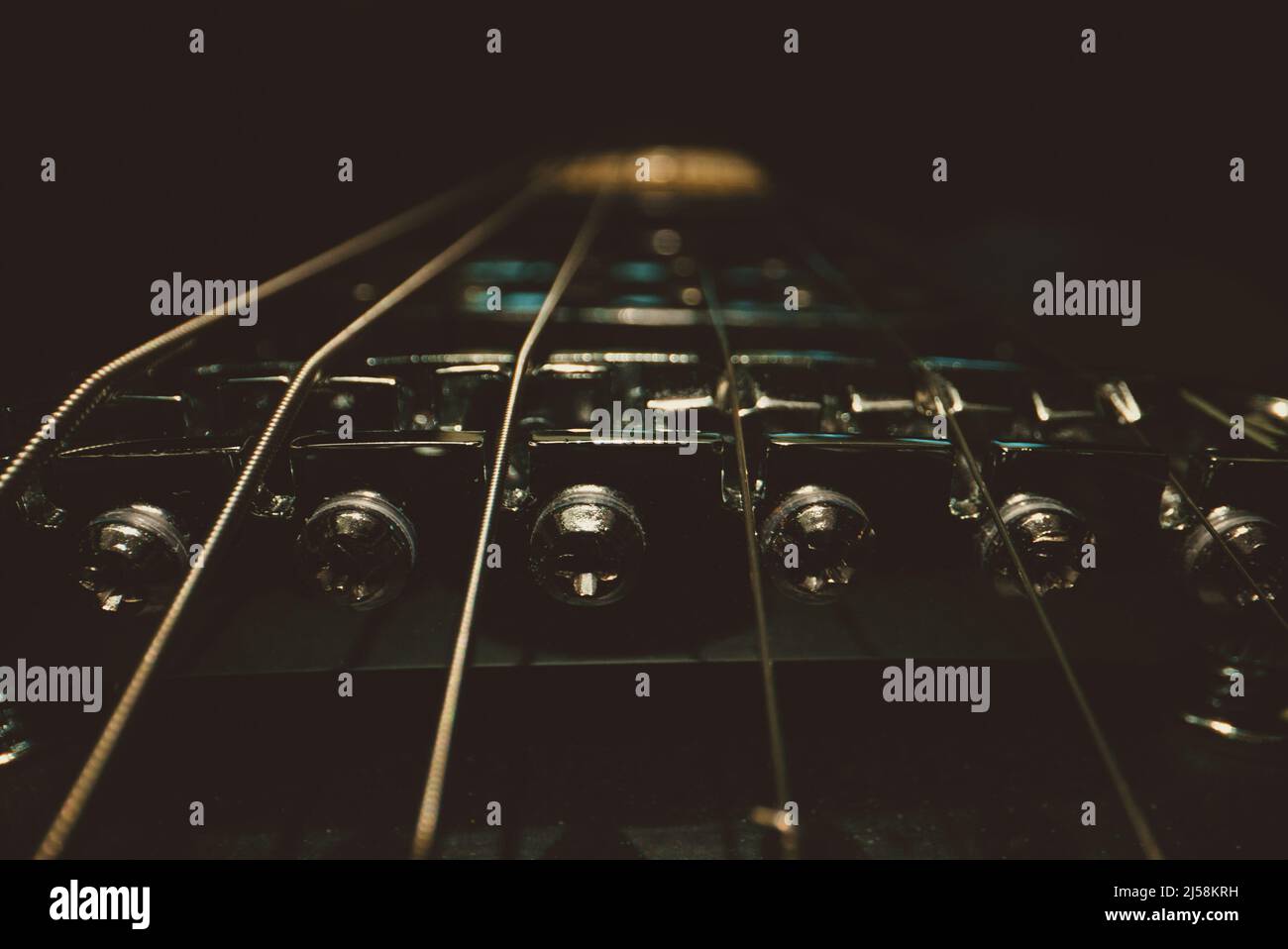 Six-string electric guitar bridge and saddle Stock Photo - Alamy