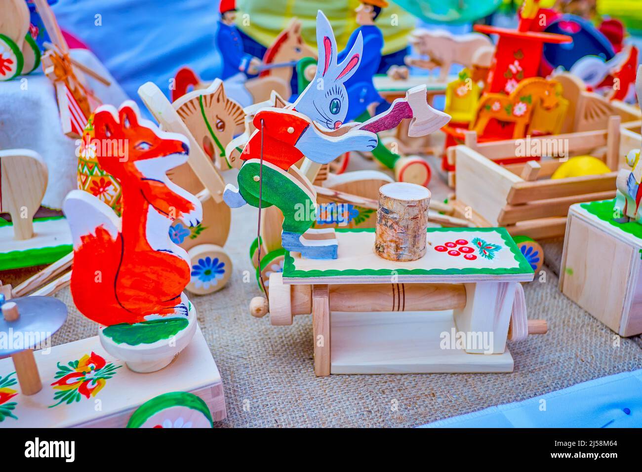 The carpenter stall with different tradiotional wooden moving toys on ...