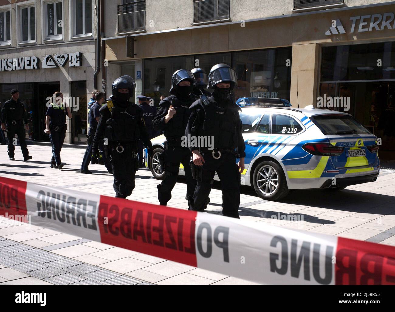 Munich, Germany. 21st Apr, 2022. Police officers stand outside a ...