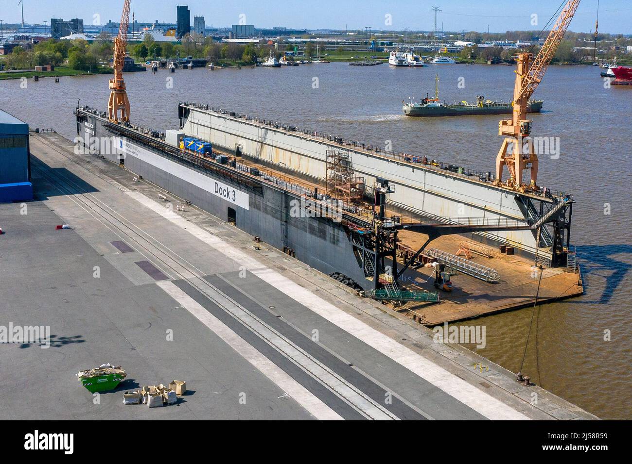 Emden, Germany. 21st Apr, 2022. A floating dock (Floating Dock III) lies at Südkai after being ...