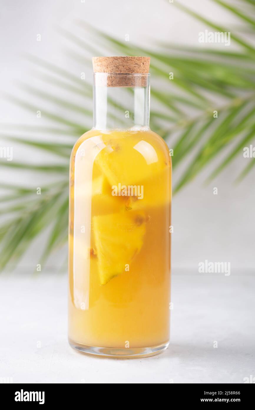 Bottle of tepache, a fermented drink of pineapples sugar and cinnamon ...